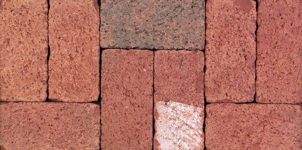 How to improve a sloped backyard with grading and clay pavers