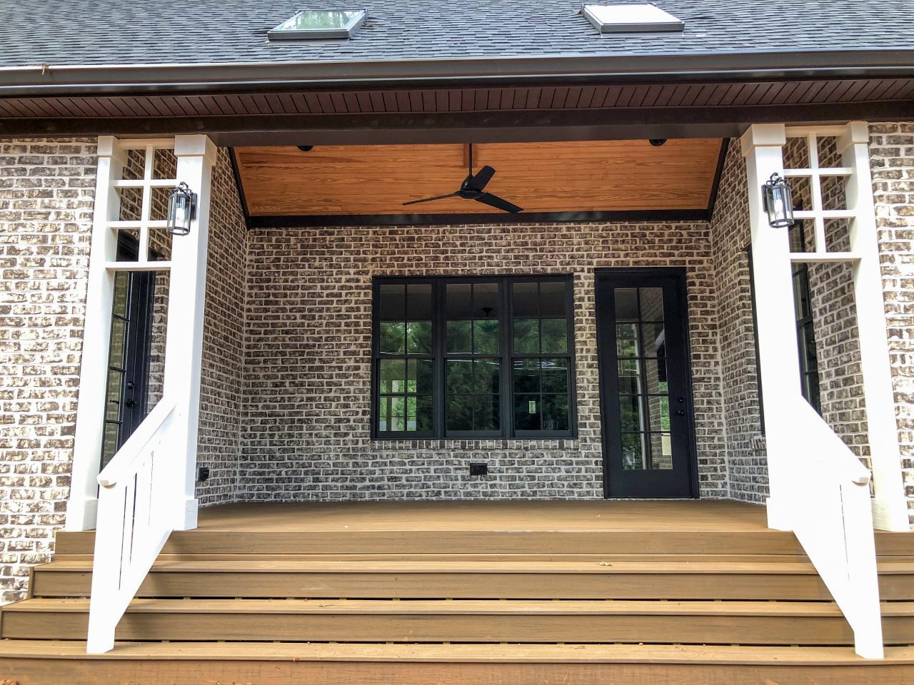 Tufts House with Ashton Court brick accents help define a modern Tudor