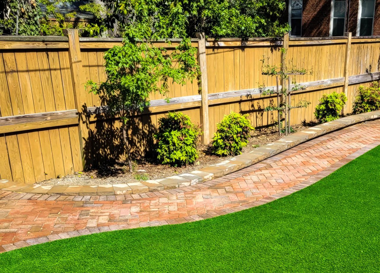 Two dogs, a baby, and a patchy lawn? Try synthetic turf and clay pavers ...