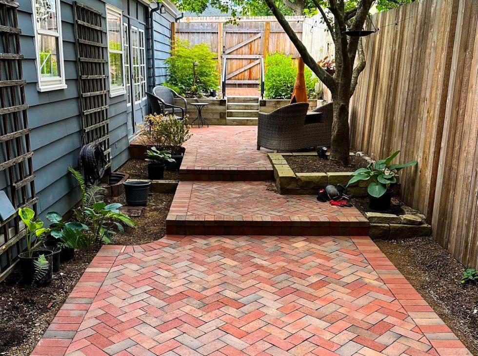 “Jake” of all trades rehabs a narrow sloping courtyard with terraced ...